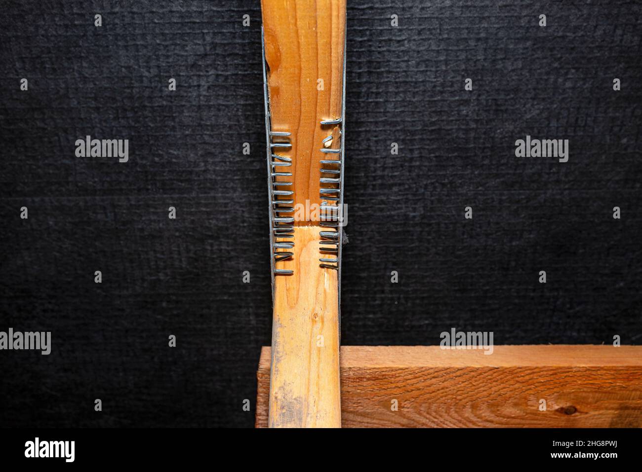 Barbed tile connecting the roof structure covered with a membrane on a ...