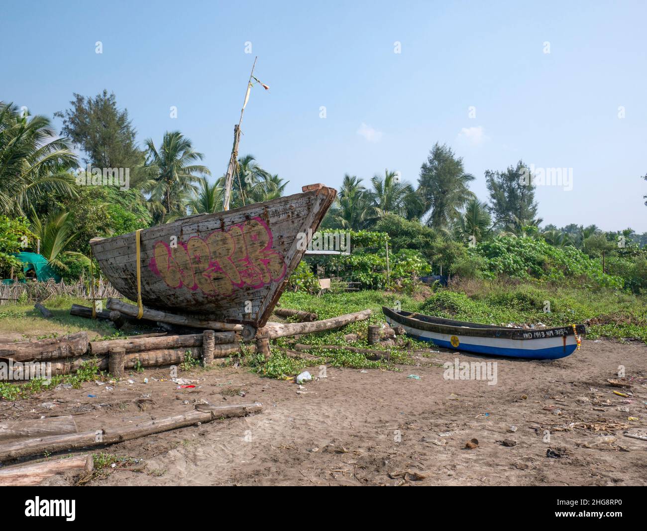 Native wooden fishing boat anchored at coastline at Revdanda near ...