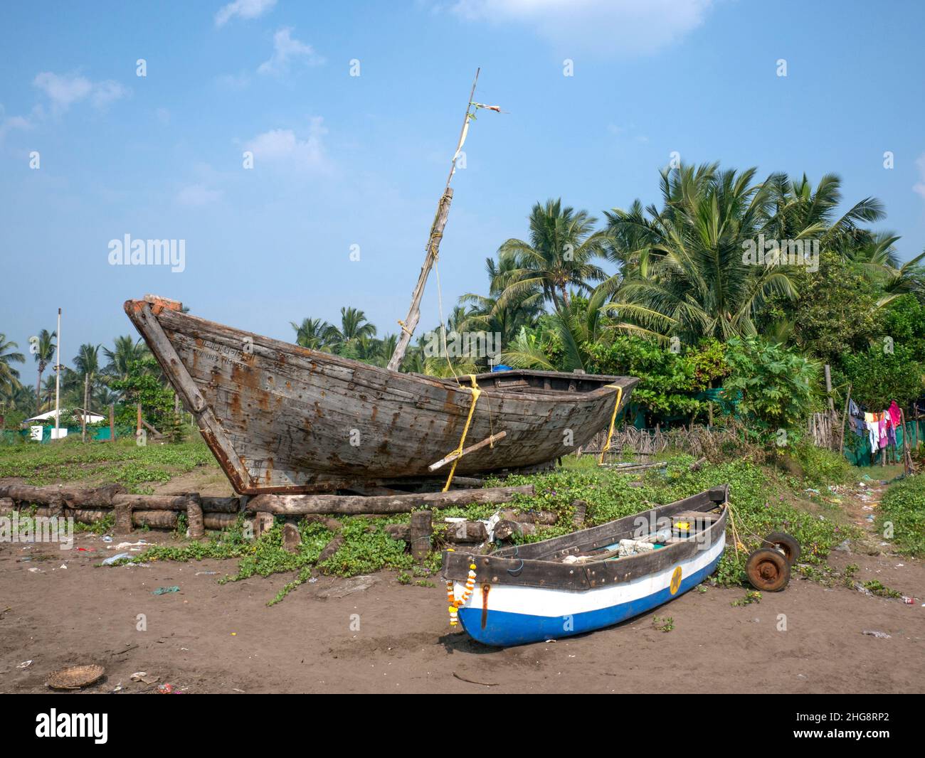 Native wooden fishing boat anchored at coastline at Revdanda near ...