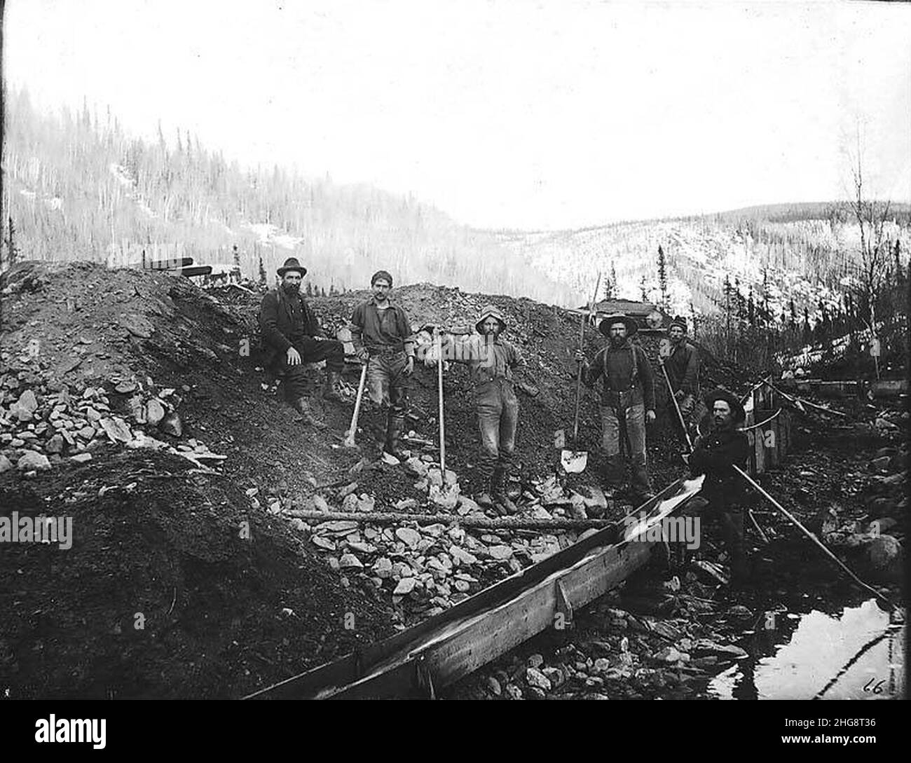 Six miners beside a flume, mining operations, Hunker Creek, ca 1900 ...
