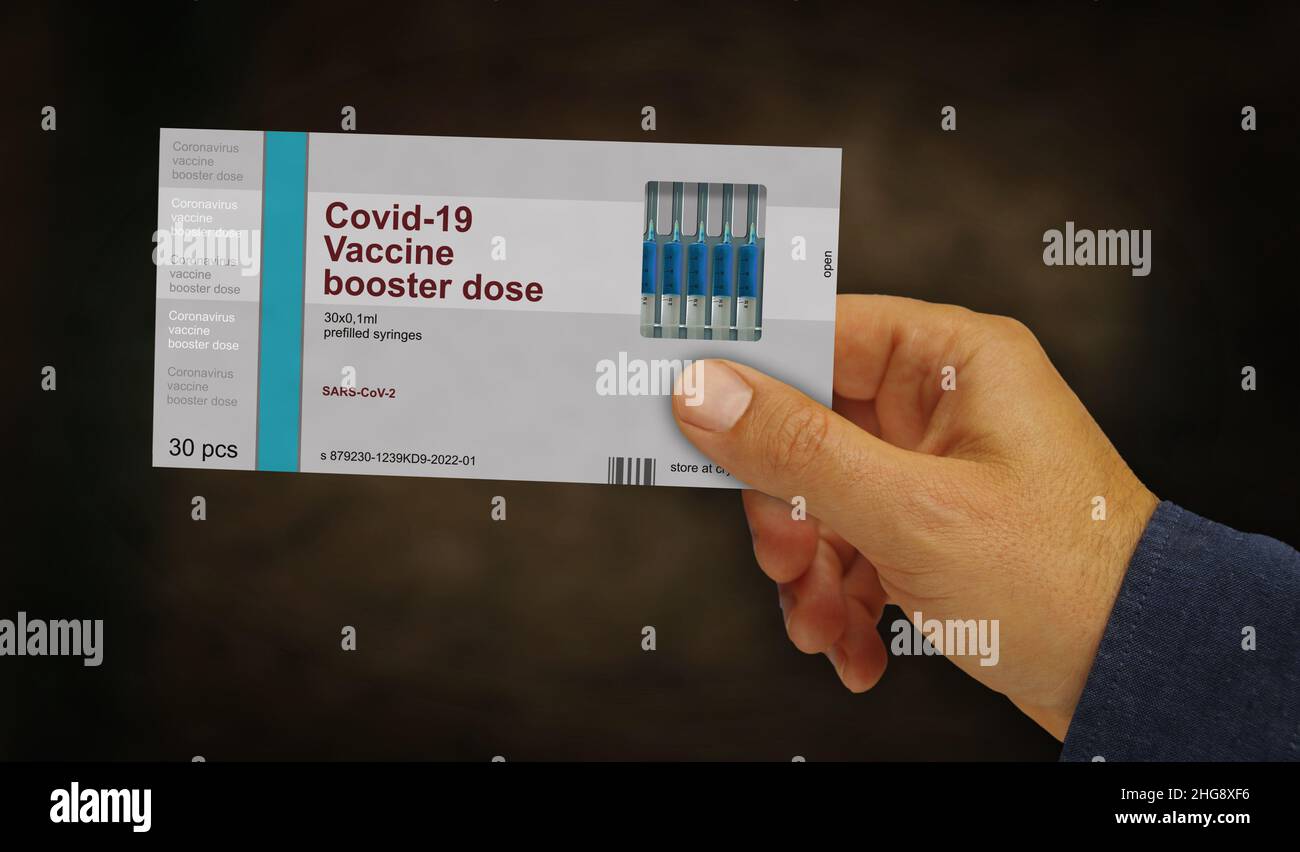 Covid-19 vaccine booster dose pack in hand. Coronavirus sars-cov-2 ...