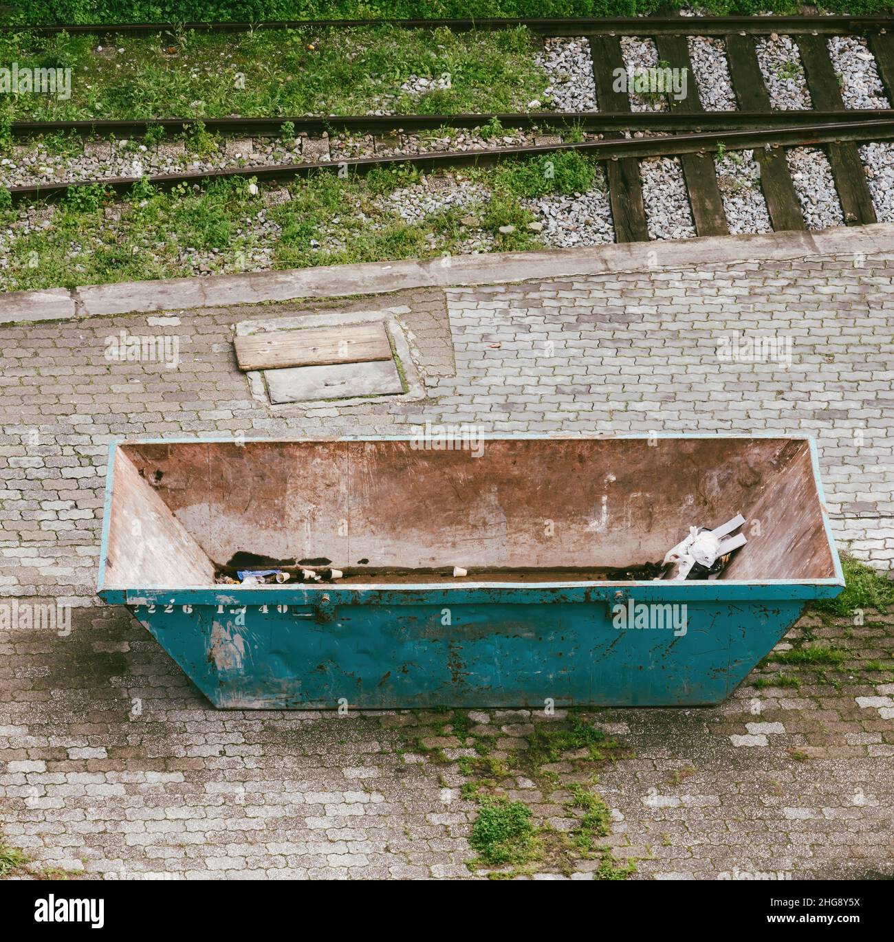 View from above of construction waste dumpster near railway Stock Photo ...