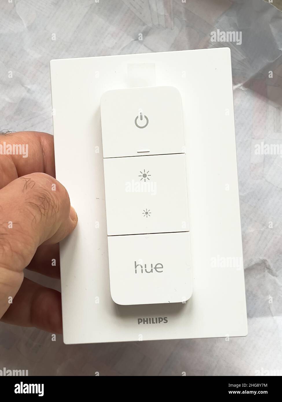 Paris, France - Dec 15, 2021: POV male hand holding new Philips Hue ...