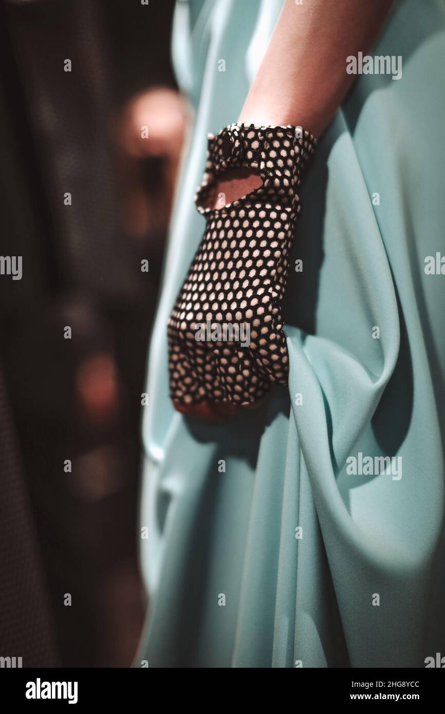 Female fashion details of creative glove and blue stylish skirt ...