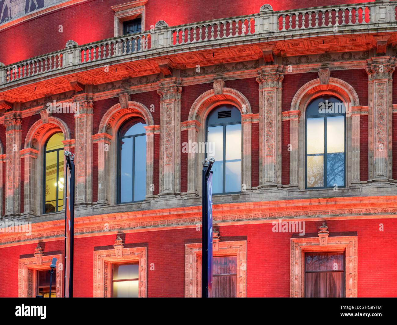 Royal Albert Hall with floodlights coming on at dusk Kensington Gore Borough of Kensington and ...