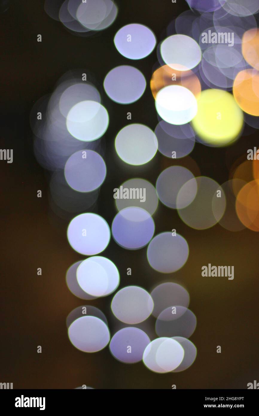 Beautiful colorful bokeh balls bouncing around as city lights Stock ...