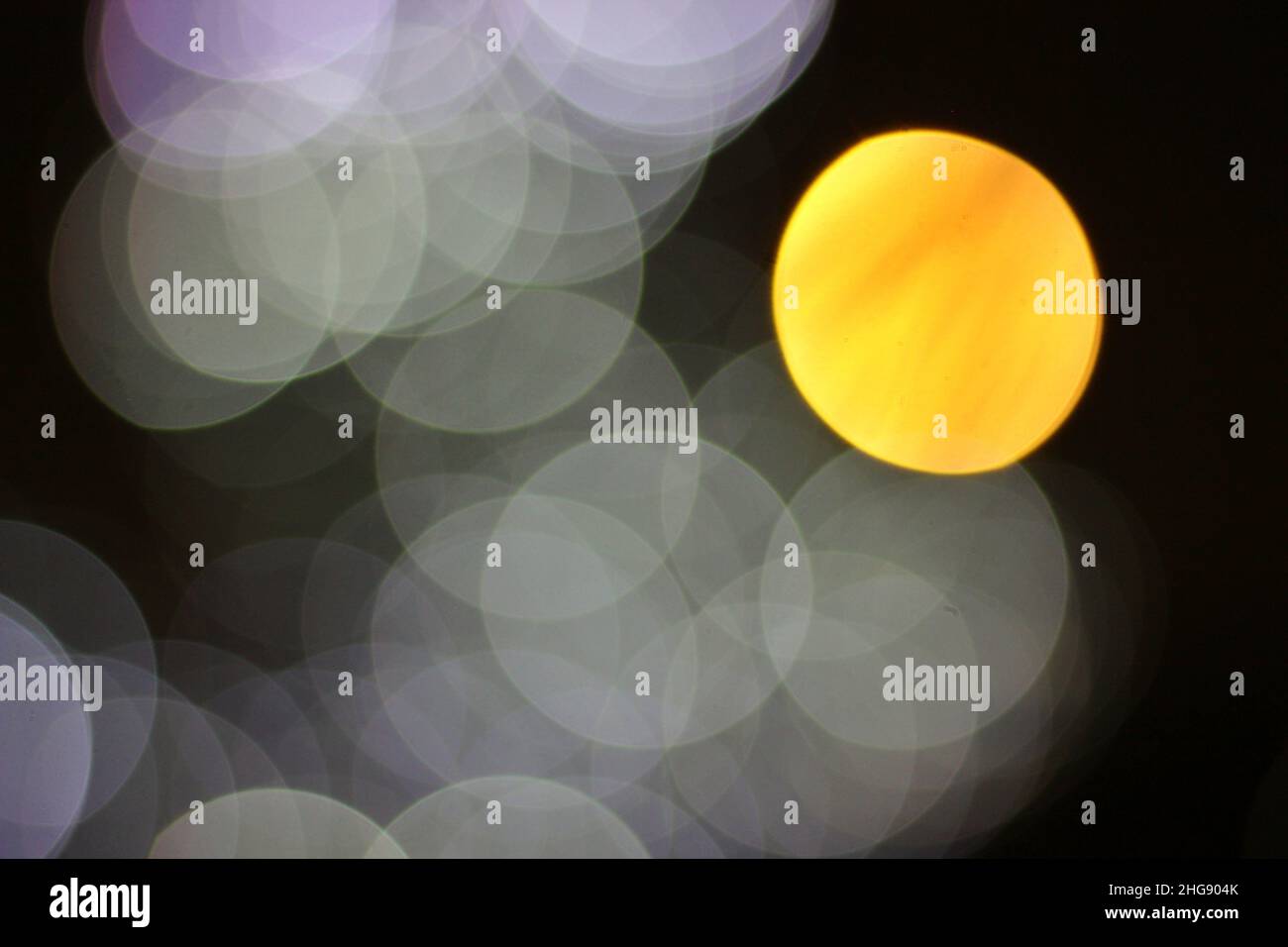 Beautiful colorful bokeh balls bouncing around as city lights Stock ...