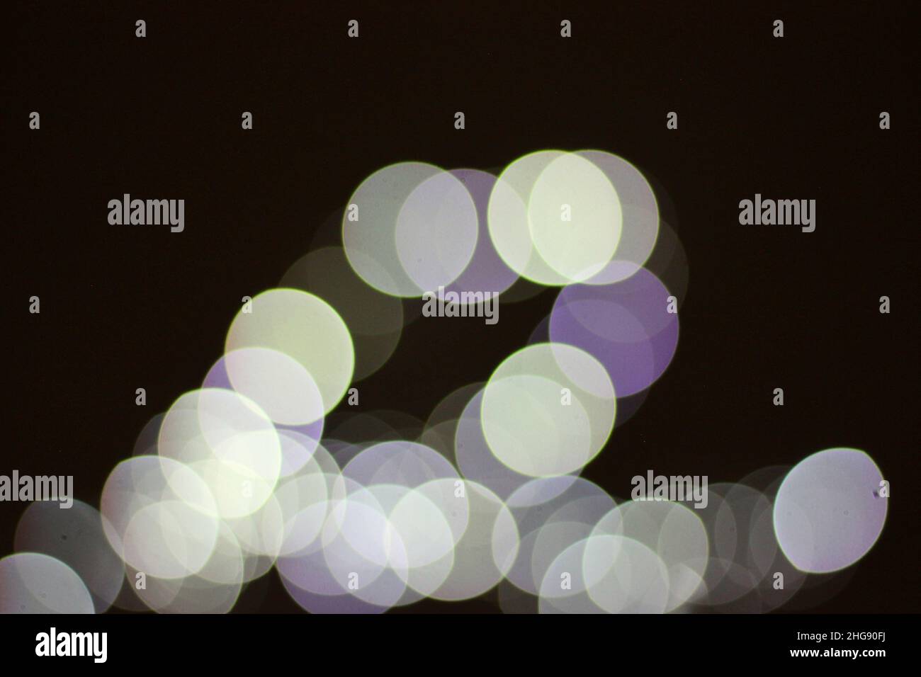 Beautiful colorful bokeh balls bouncing around as city lights Stock ...