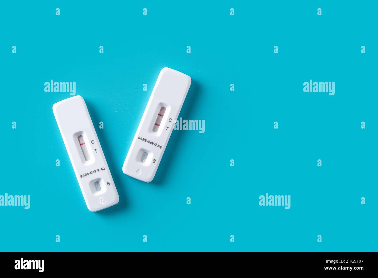 Covid-19 rapid antigen test on blue background Stock Photo - Alamy