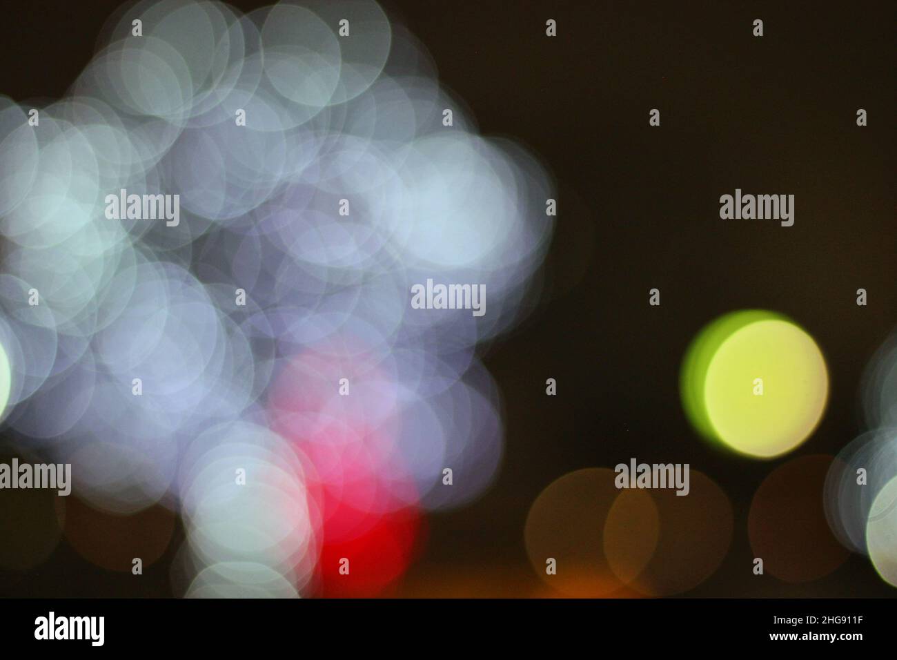 Beautiful colorful bokeh balls bouncing around as city lights Stock ...