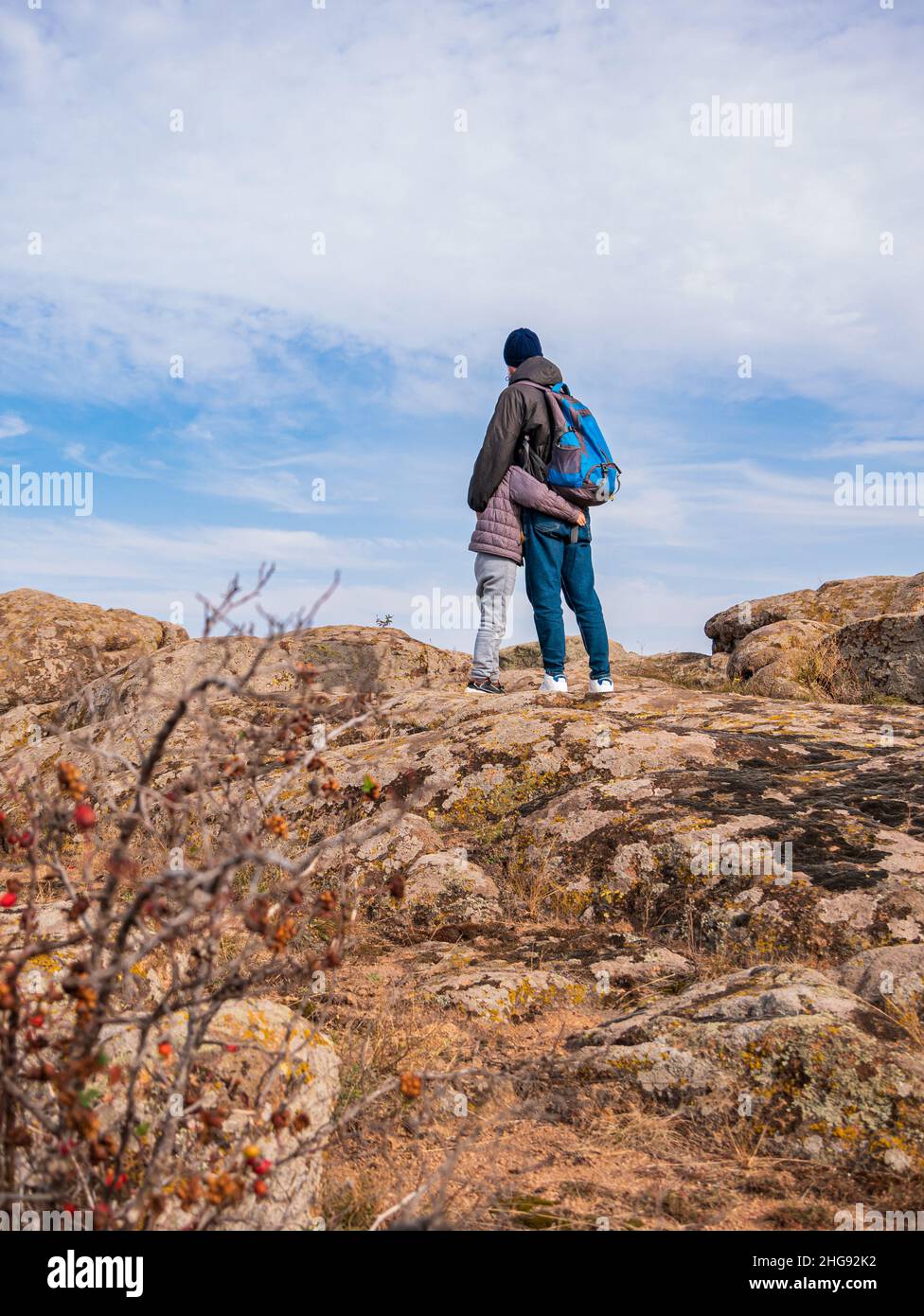 Travelers father and daughter walking climbing on mountain summit ...