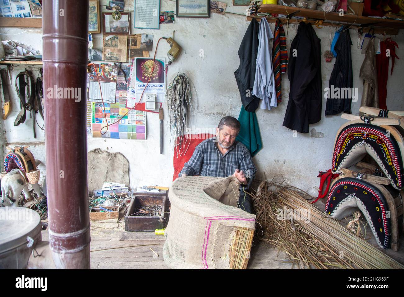 Manisa,Turkey - 04-23-2016:Craftsman making a saddle in his workshop ...