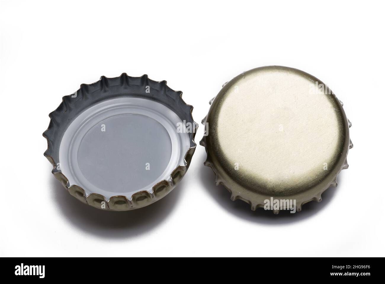 Close up of two crown caps seen from different sides from top and ...