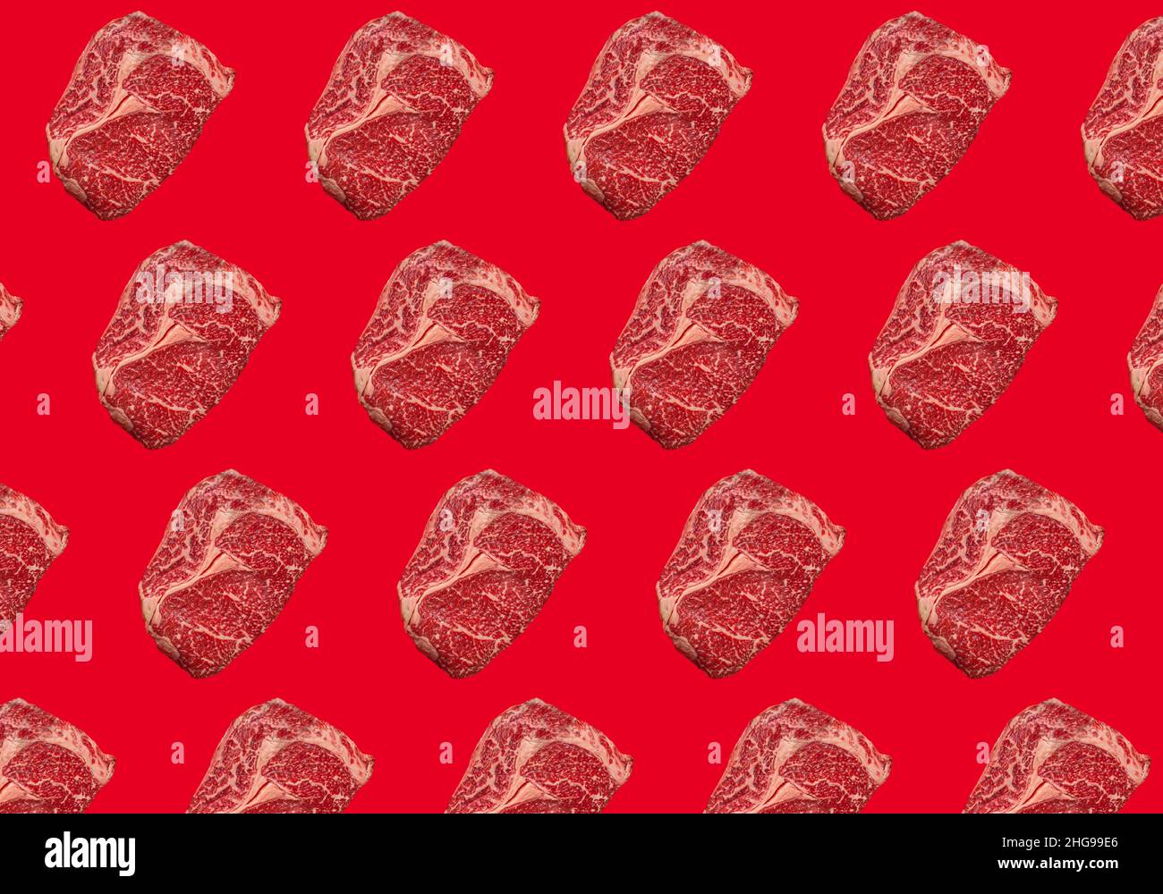 Pattern made of raw meat beef marbled prime cut steak Ribeye on red ...