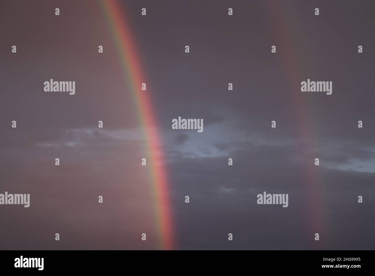 Double rainbow in the dramatic sky Stock Photo - Alamy