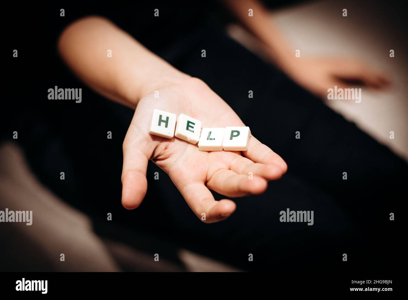 Girl asking for help. Girl stretches out her hands with the word help ...