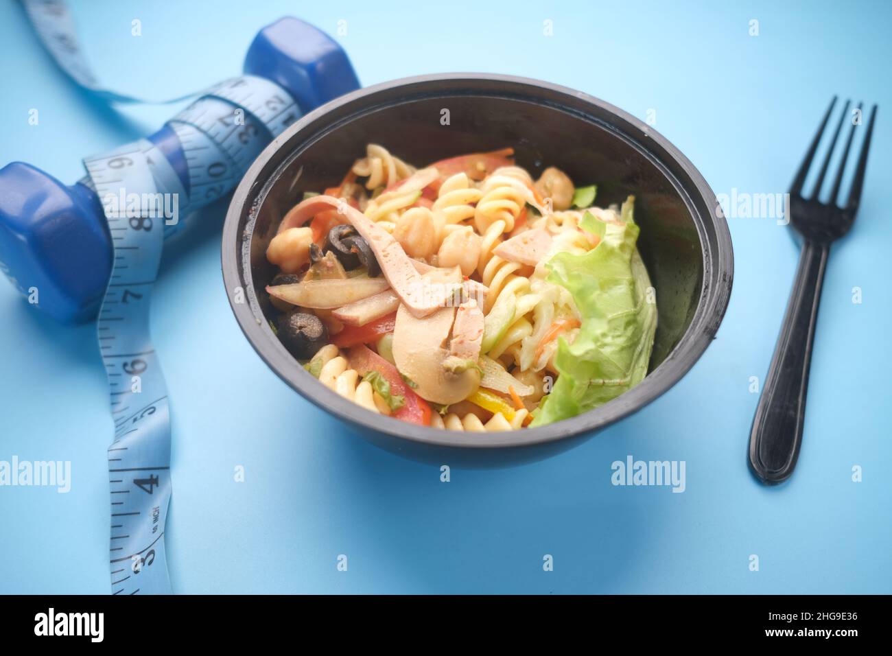 homemade fresh healthy food in a plate with dumbbell on table Stock ...