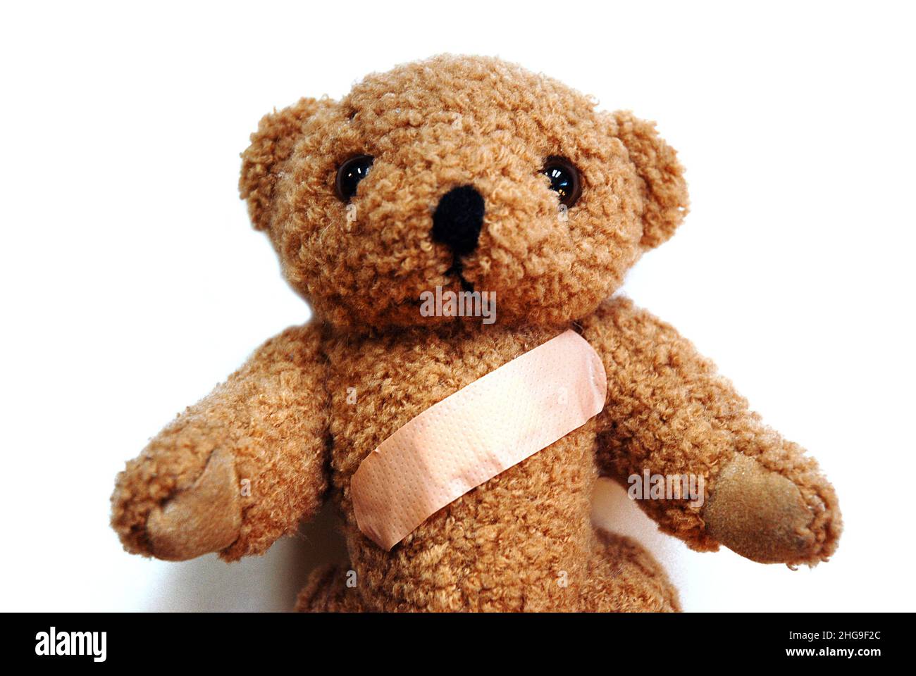 Teddy bear with a plaster Stock Photo - Alamy