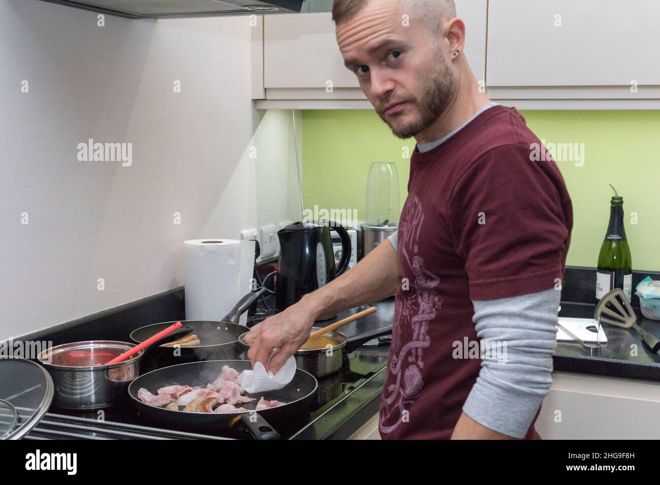 Well groomed young man cooking hi-res stock photography and images - Alamy