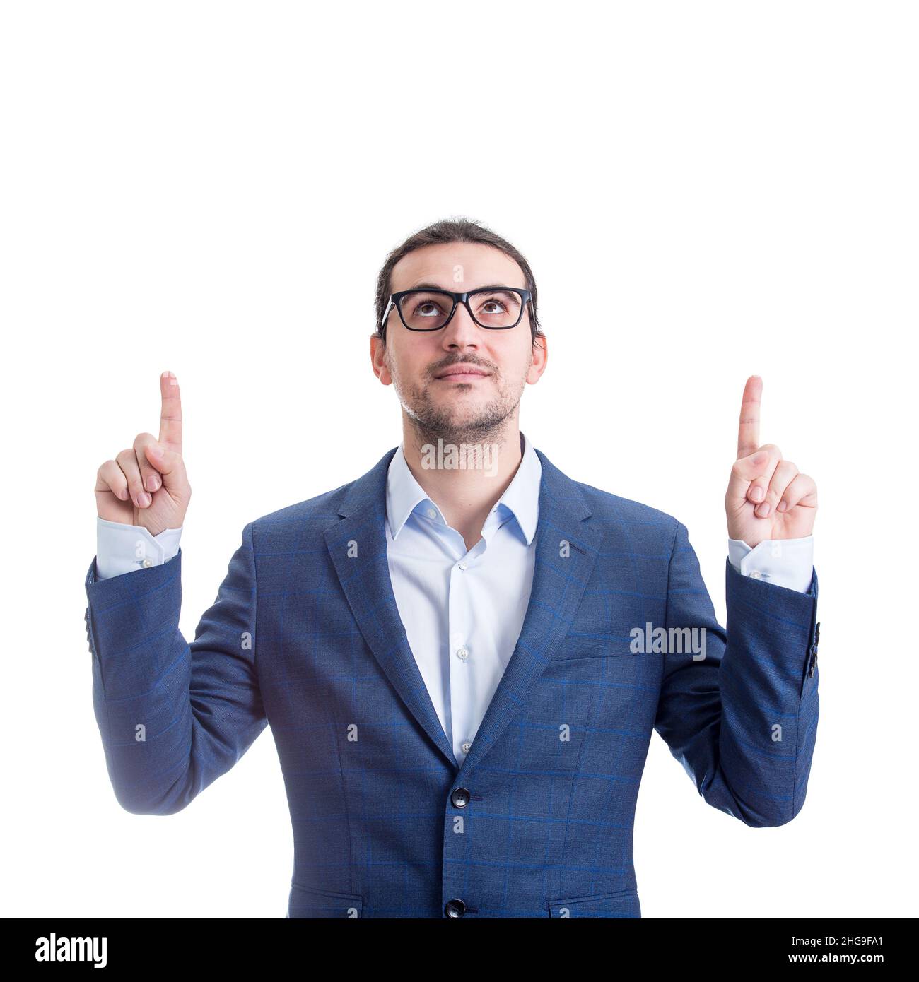 Confident businessman pointing up index fingers, looking satisfied ...