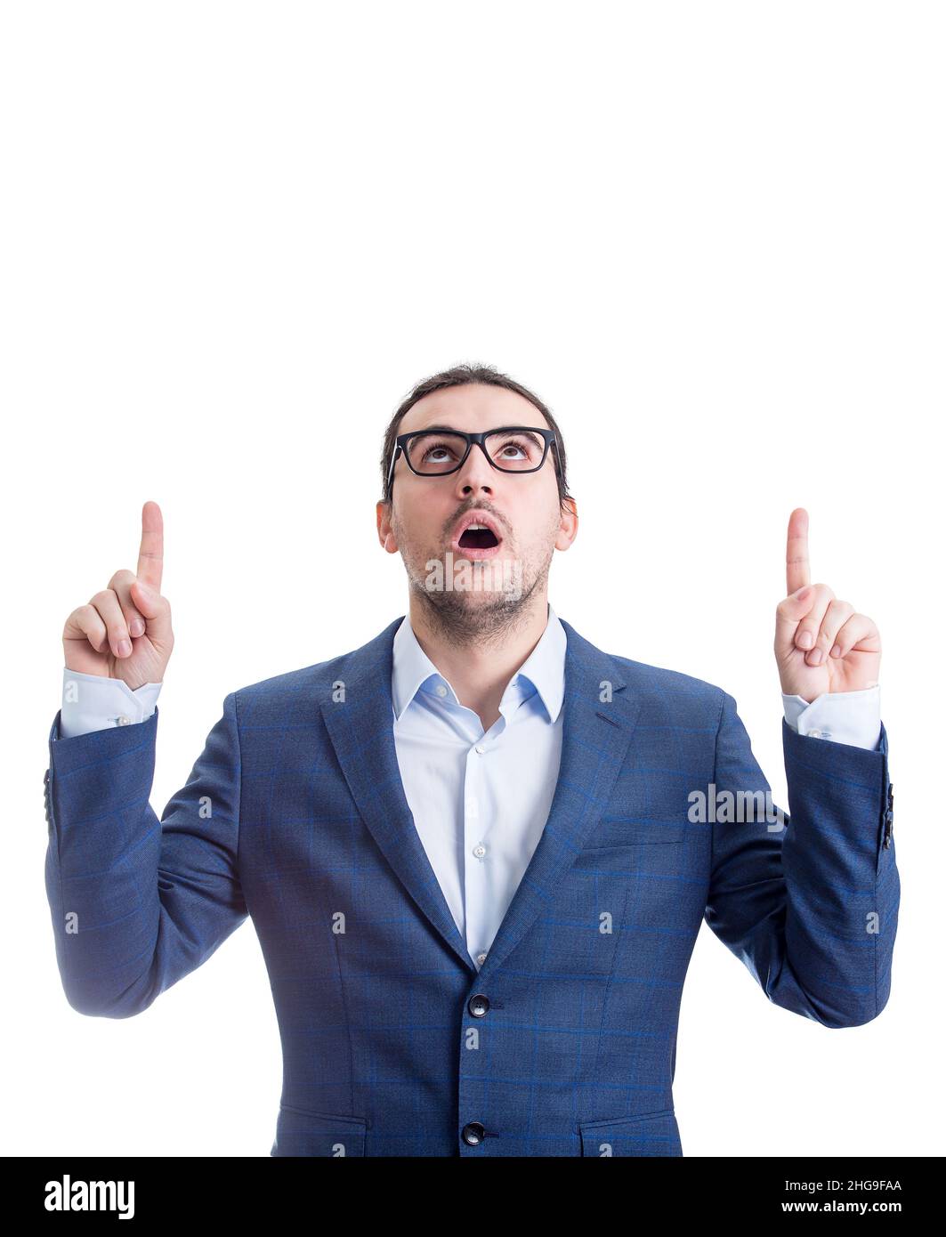 Amazed businessman pointing up index fingers, looking shocked isolated ...