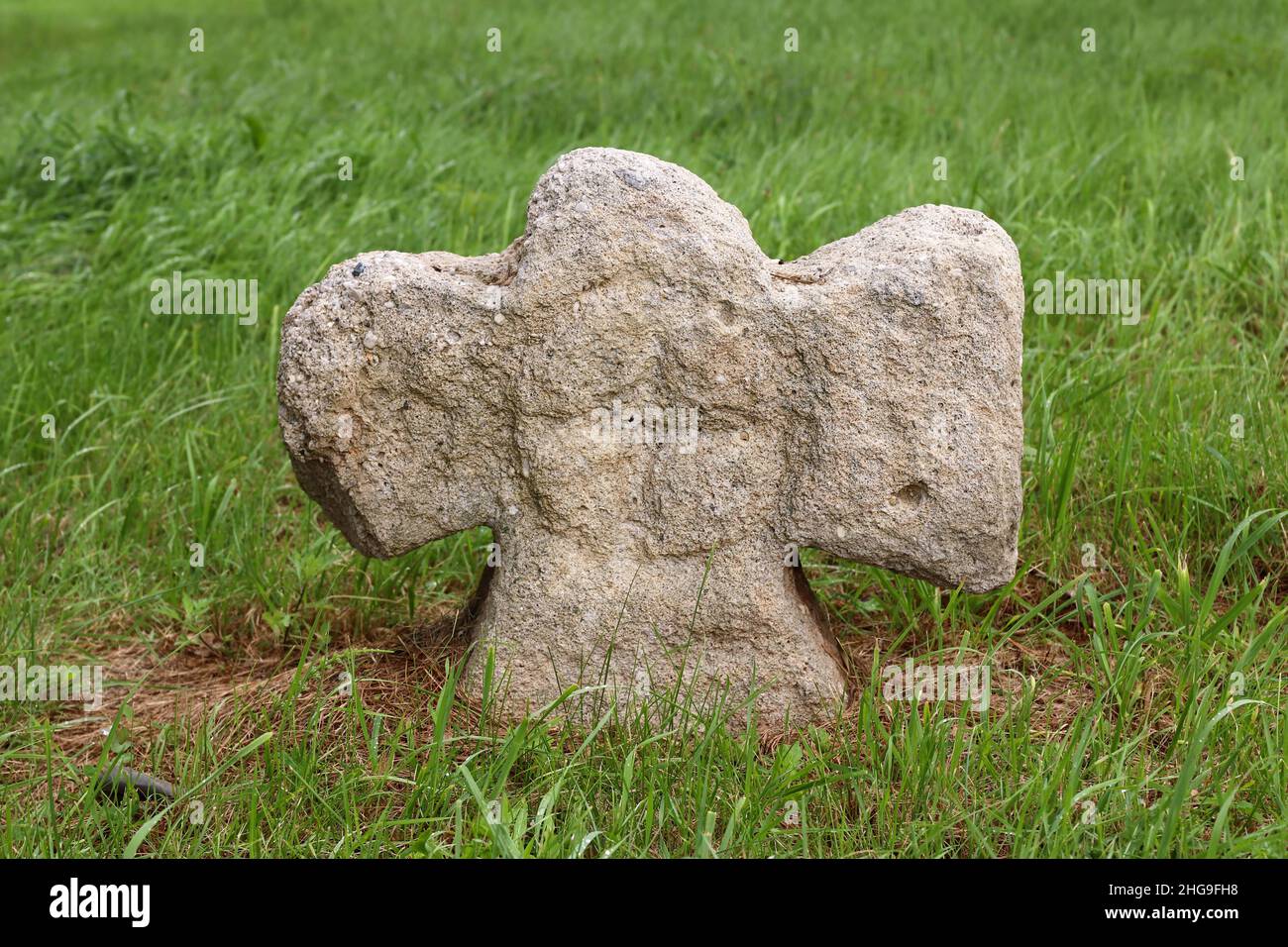 Old stone cross with a relief of the cross - conciliation cross close ...