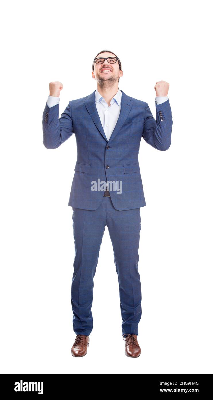 Full length portrait thankful and pleased businessman keeps fists ...
