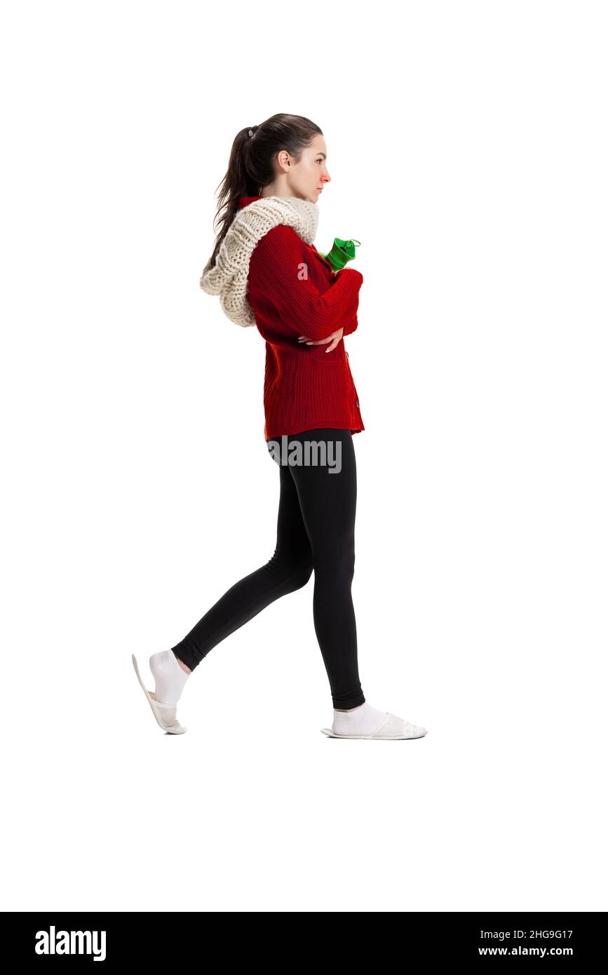 Profile view of sad young girl feeling sick, has running nose wearing ...