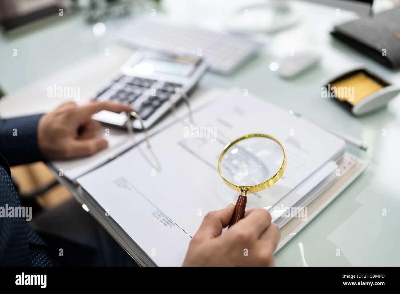 Auditor Using Magnifying Glass For Audit And Fraud Investigation Stock ...