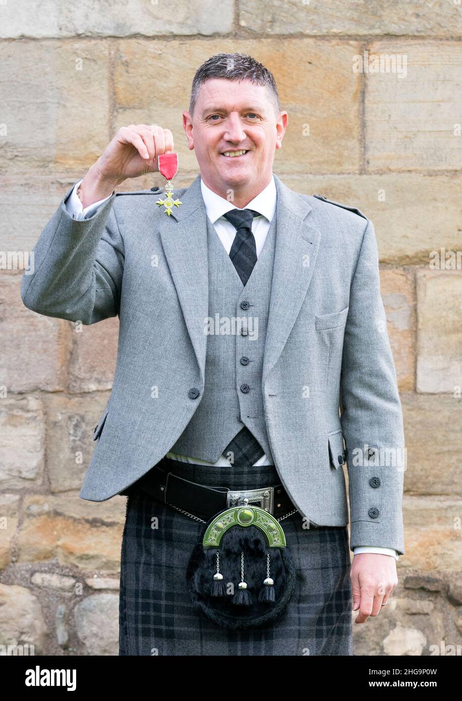 CraigThomson after receiving his MBE during an Investiture ceremony at ...