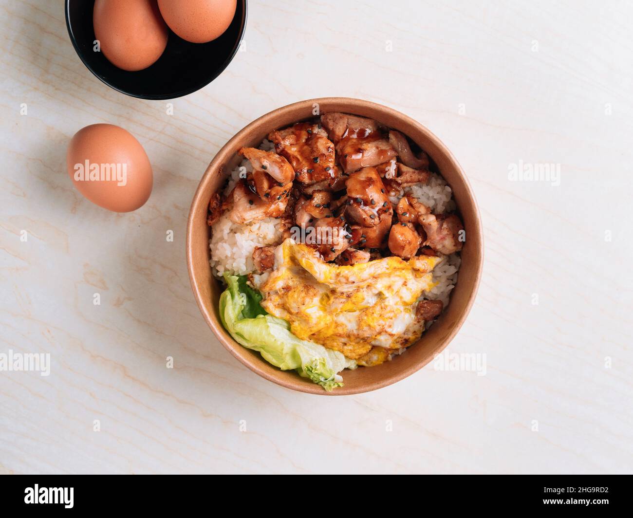 Chicken Don with rice, egg served in japanese style food set top view ...