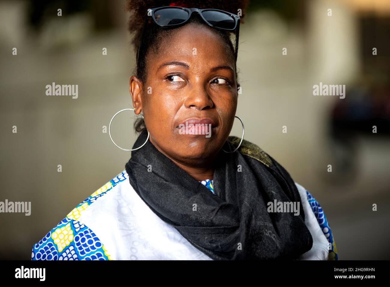 mature business woman with scarf wrapped around her neck looking ...