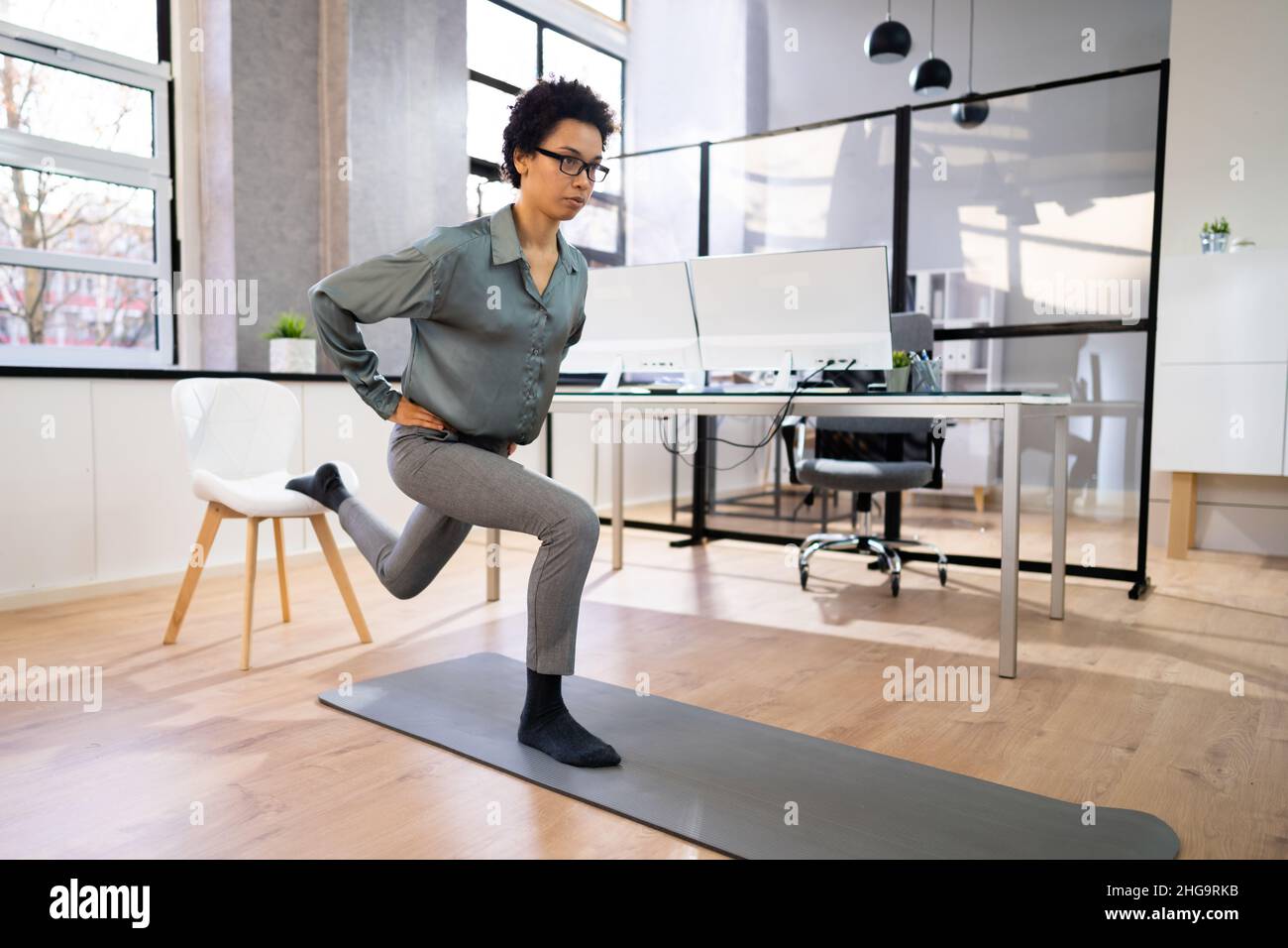African Squat Employee Doing Bulgarian Split Squat Exercise In Office ...