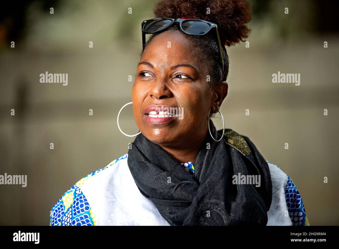 mature business woman with scarf wrapped around her neck looking ...