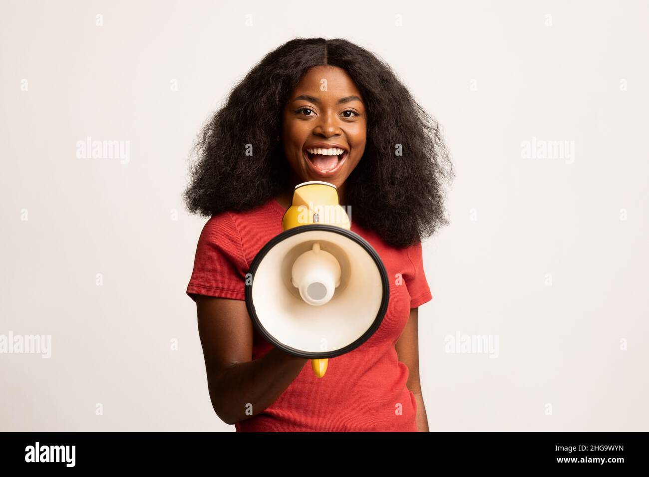 Cheerful Young African American Female Making Announcement With ...