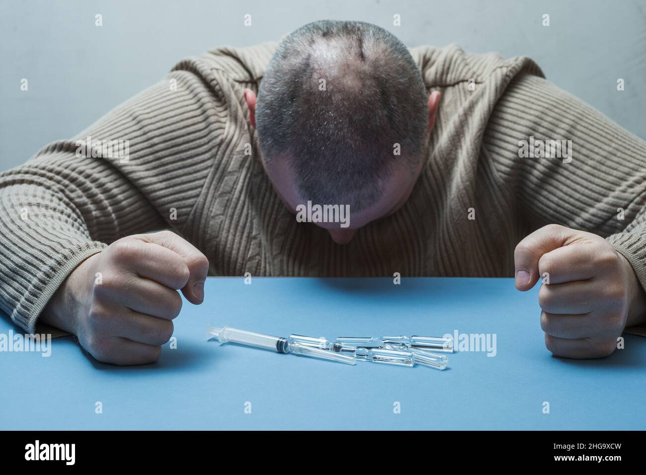 The man lowered his head and clenched his hands into fists, medical ...