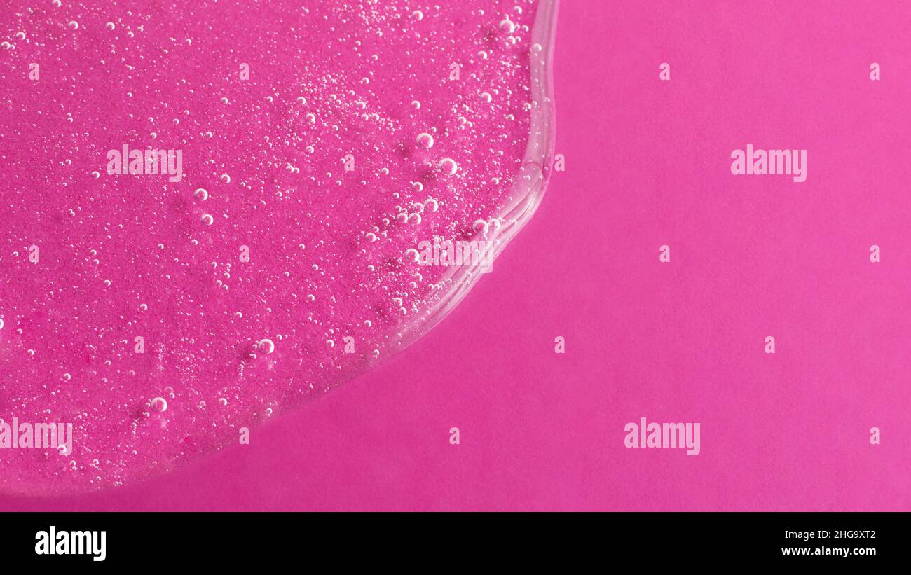Background from cosmetic gel with bubbles,dripping down.Top view ...