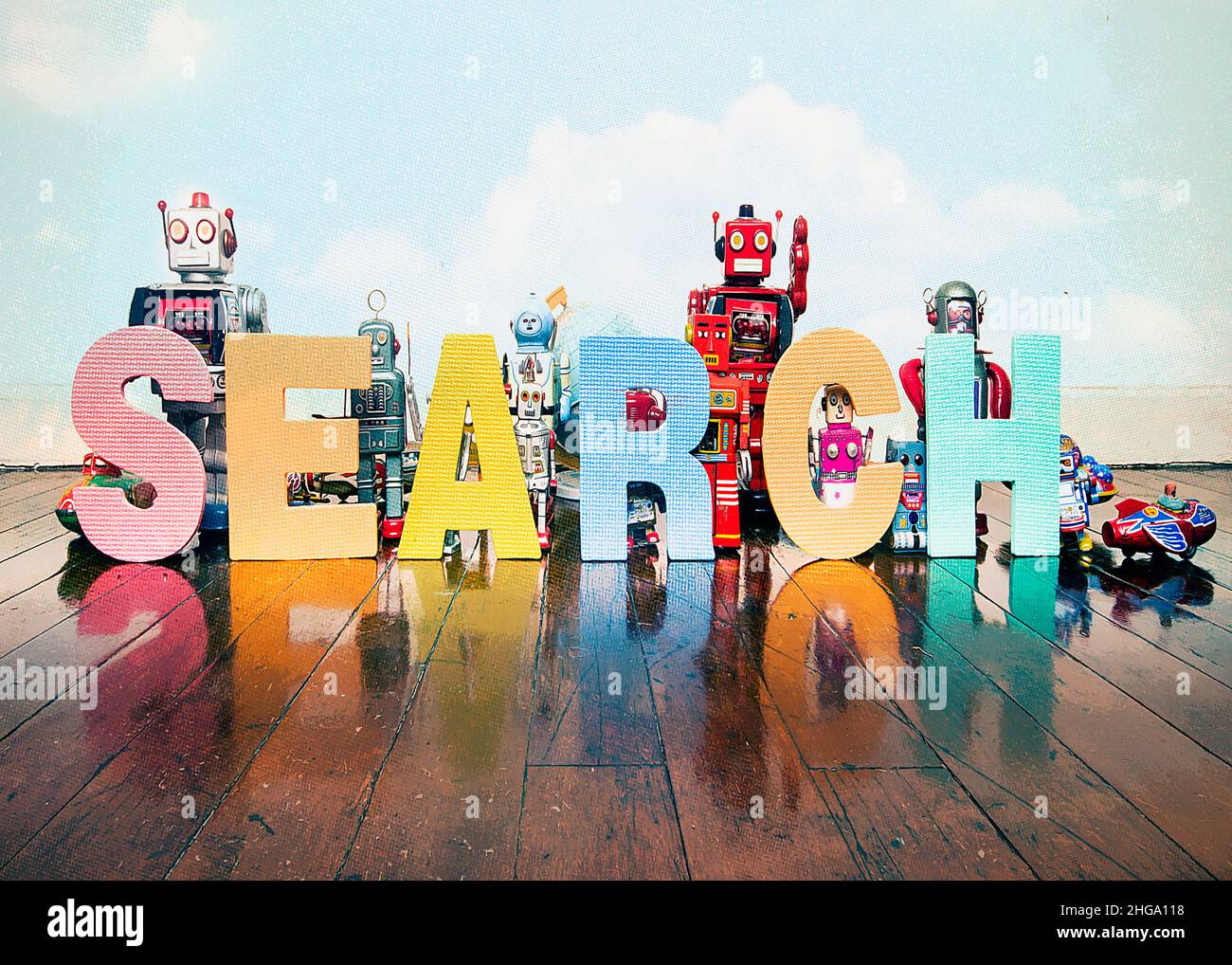 the word SEARCH on wooden floor with reto robots Stock Photo - Alamy
