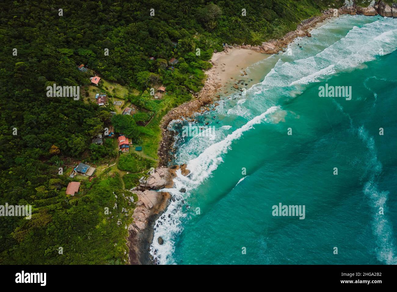 Tropical coastline with mountains and blue ocean with waves in Brazil ...