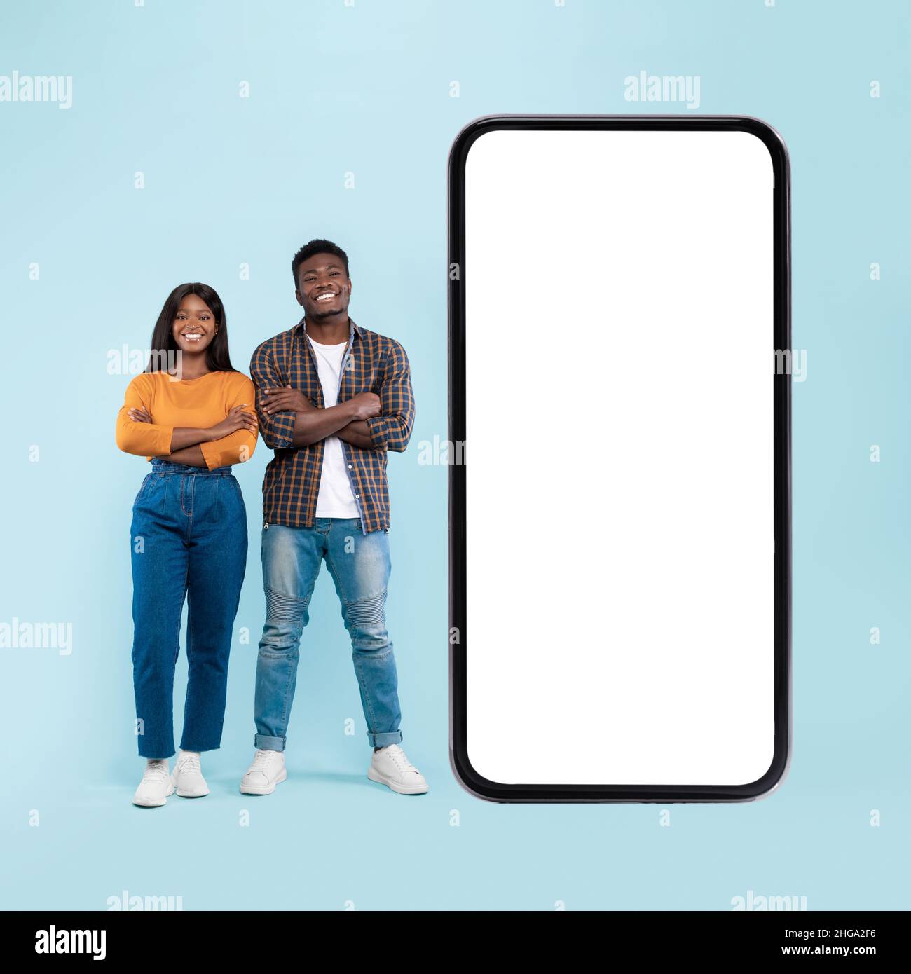 Couple showing white empty smartphone screen, blank display Stock Photo ...