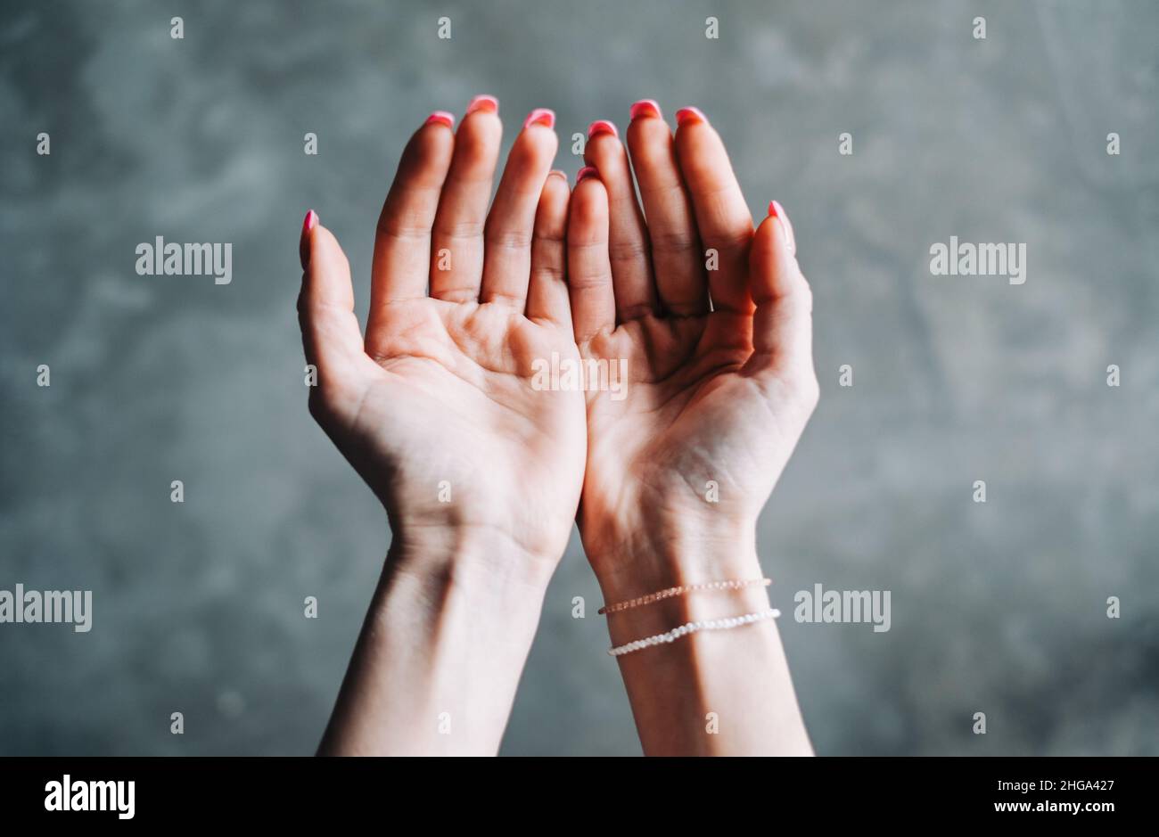 Young woman showing palms, top view Stock Photo - Alamy