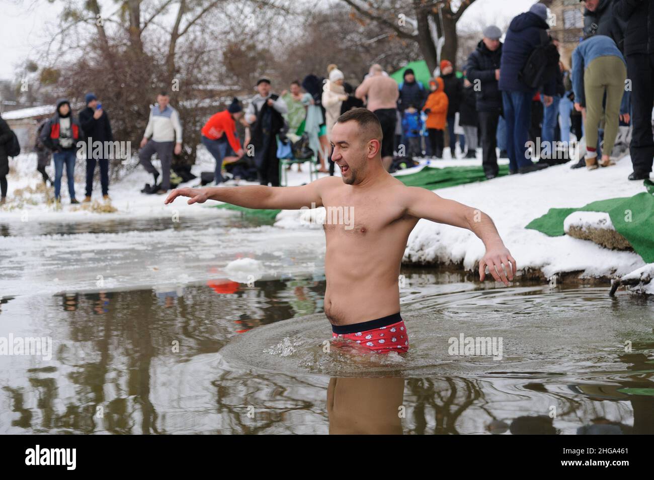 Lviv, Ukraine. 19th Jan, 2022. A man takes a bath in cold water during ...