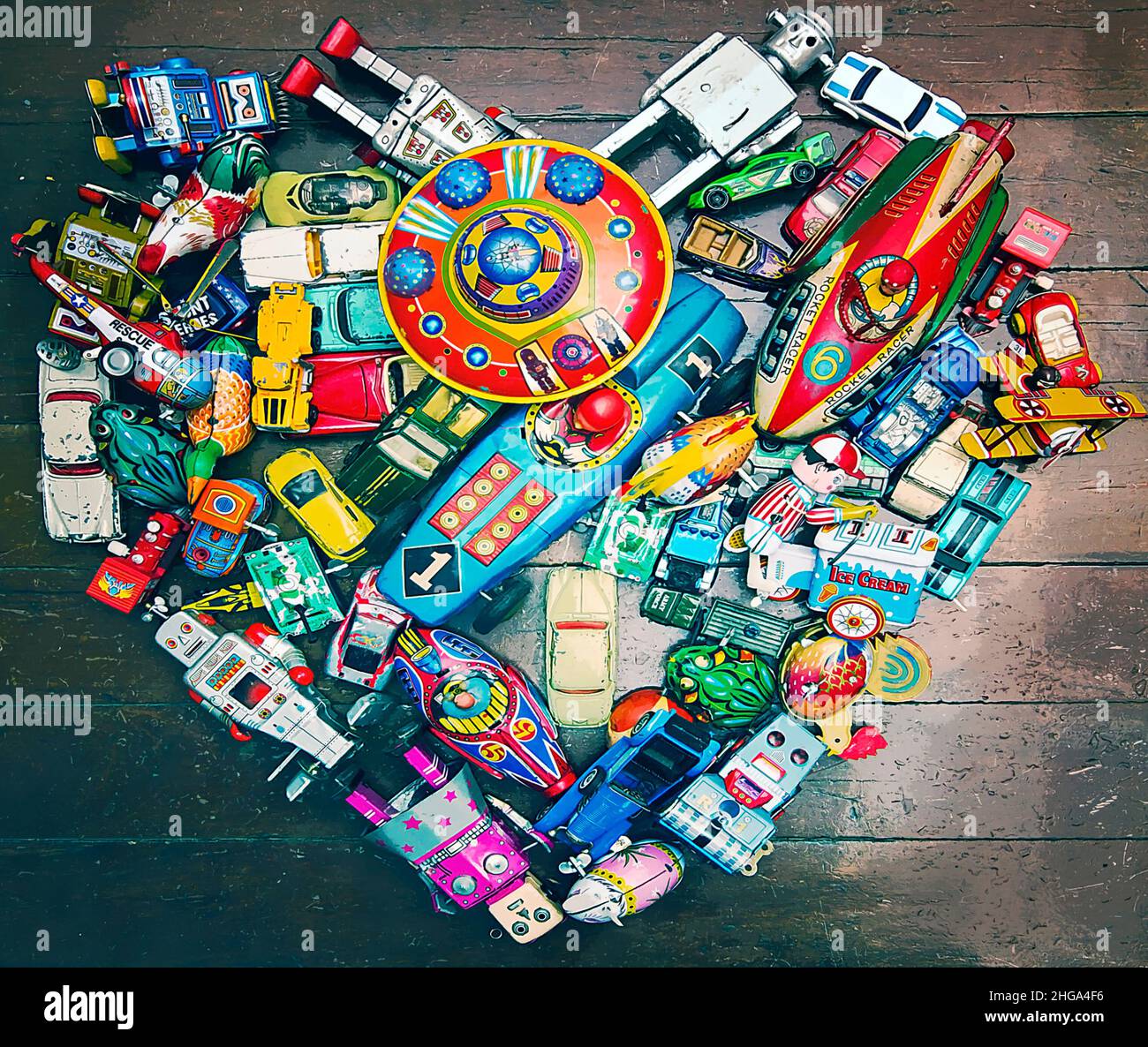 a large collection of tin toys in a heart shape Stock Photo - Alamy