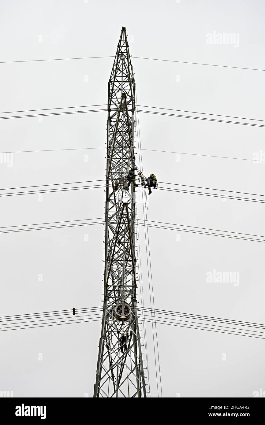 Installation and assembly of high-rise electrical towers Stock Photo ...