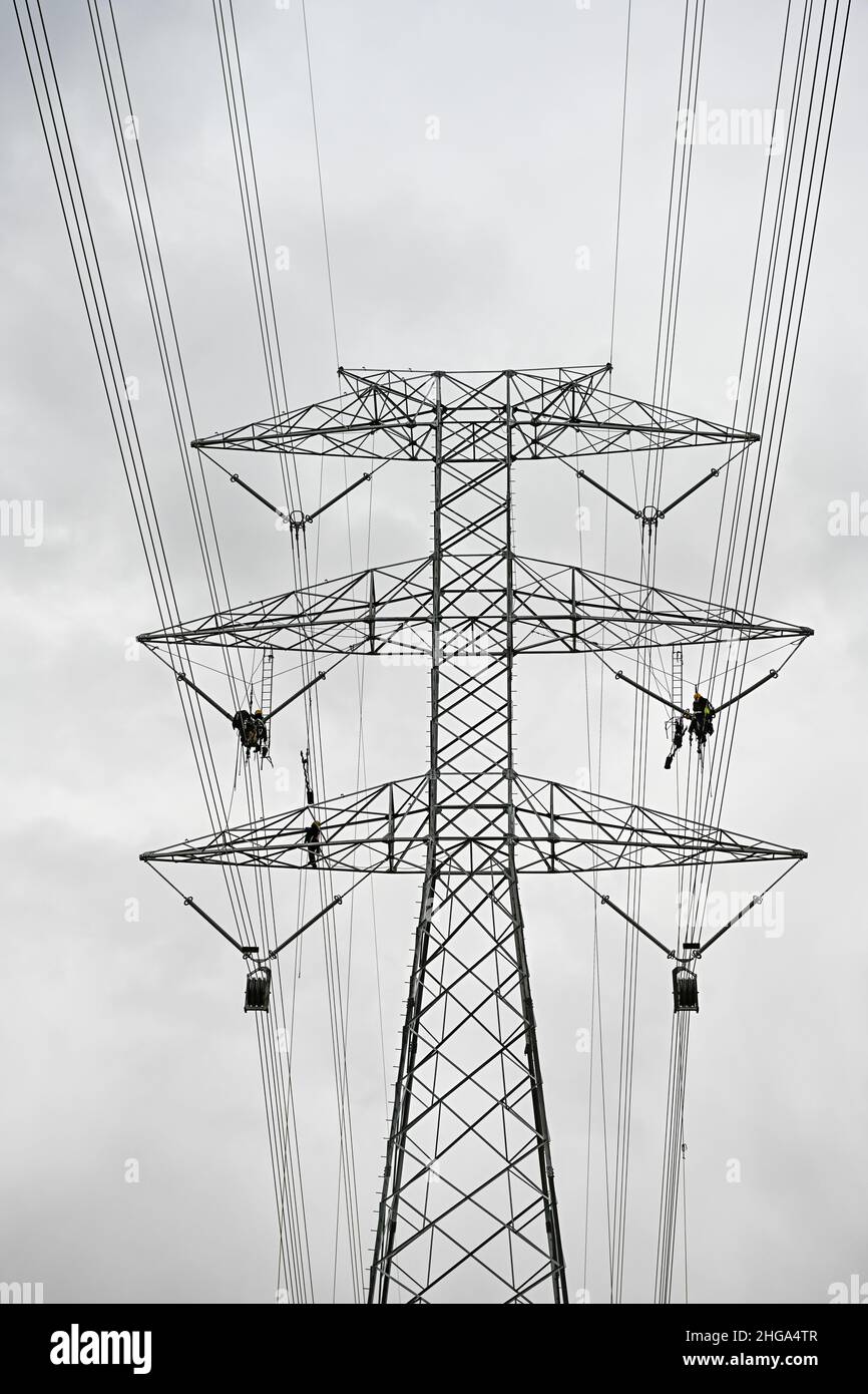 Installation and assembly of high-rise electrical towers Stock Photo ...