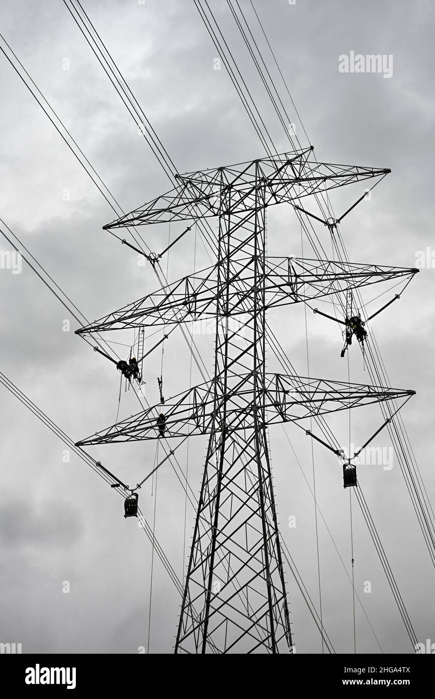 Installation and assembly of high-rise electrical towers Stock Photo ...