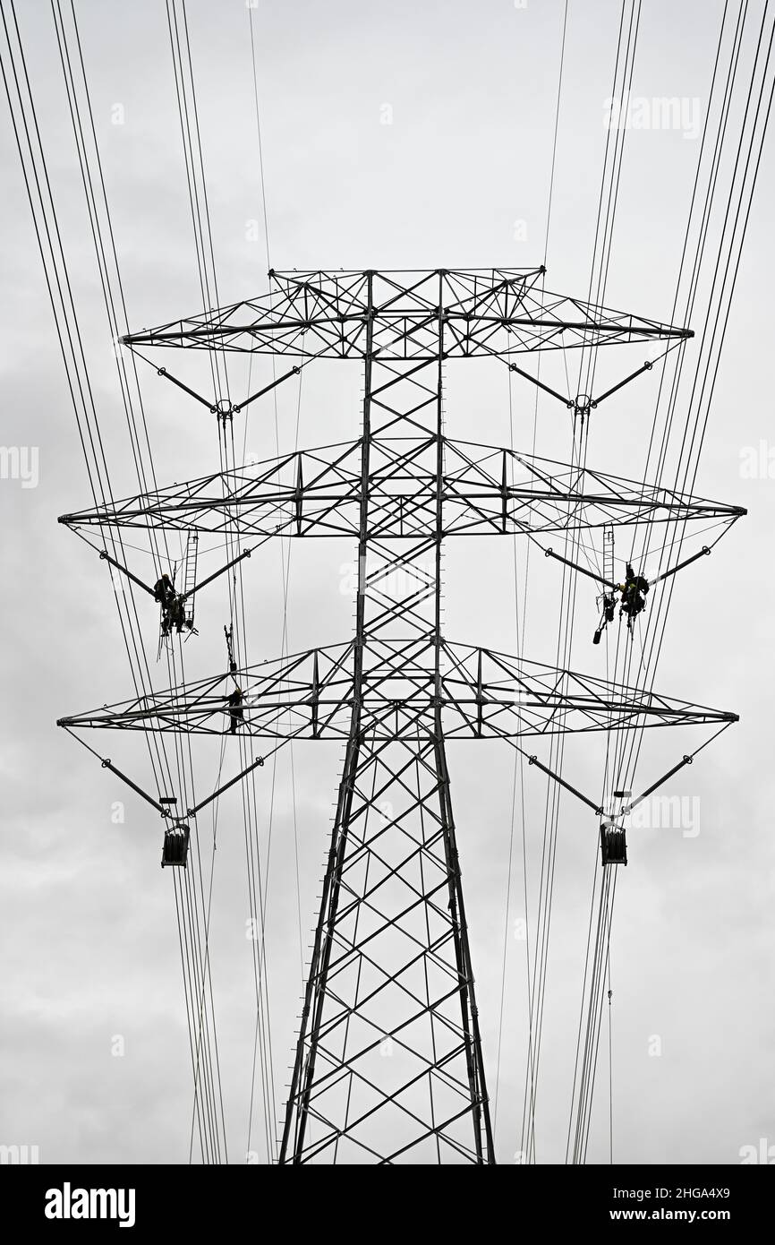 Installation and assembly of high-rise electrical towers Stock Photo ...