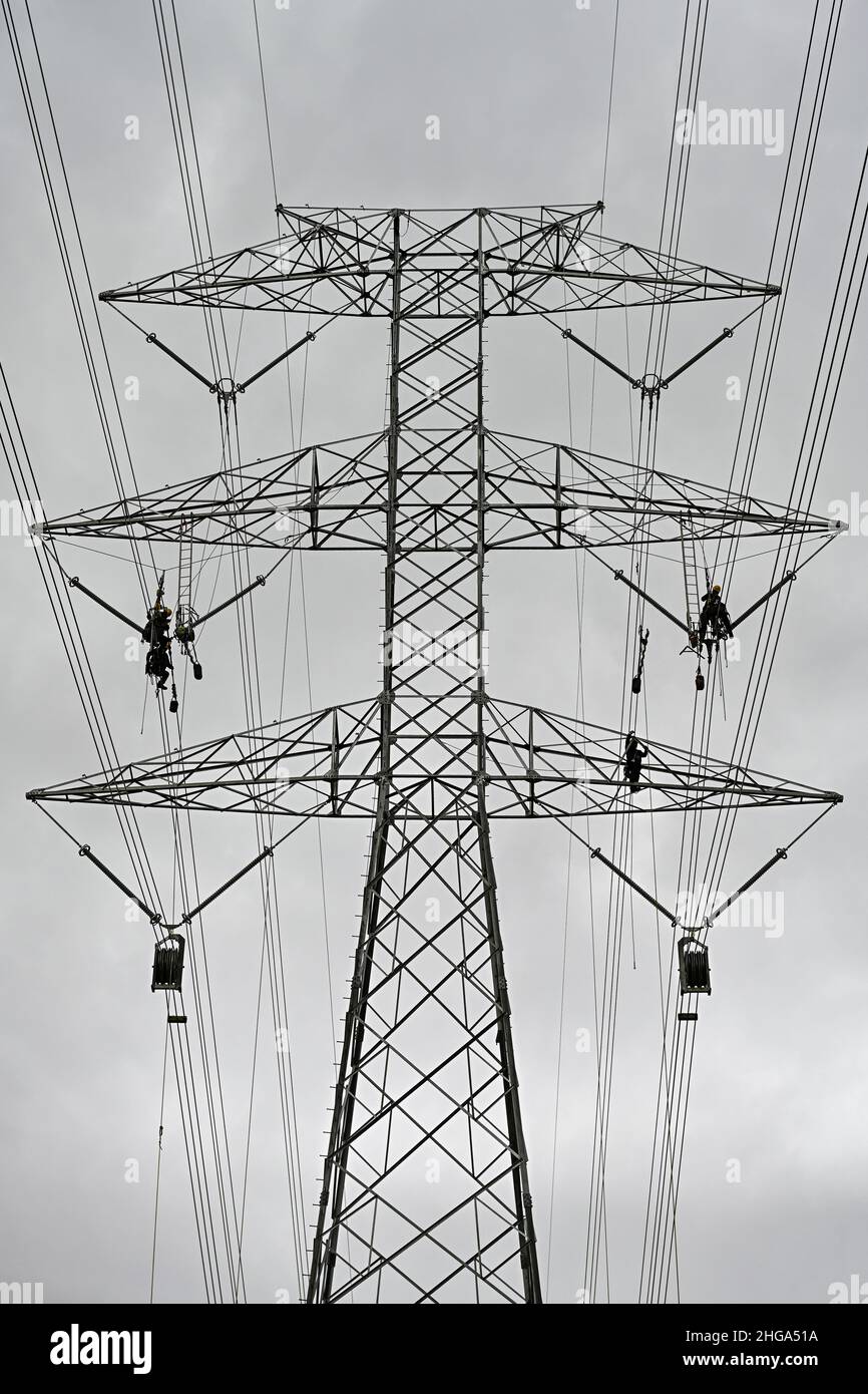Installation and assembly of high-rise electrical towers Stock Photo ...
