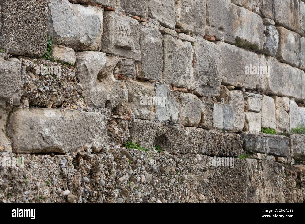 The wall is paved with gray stones, top view. stone texture, outdoor ...