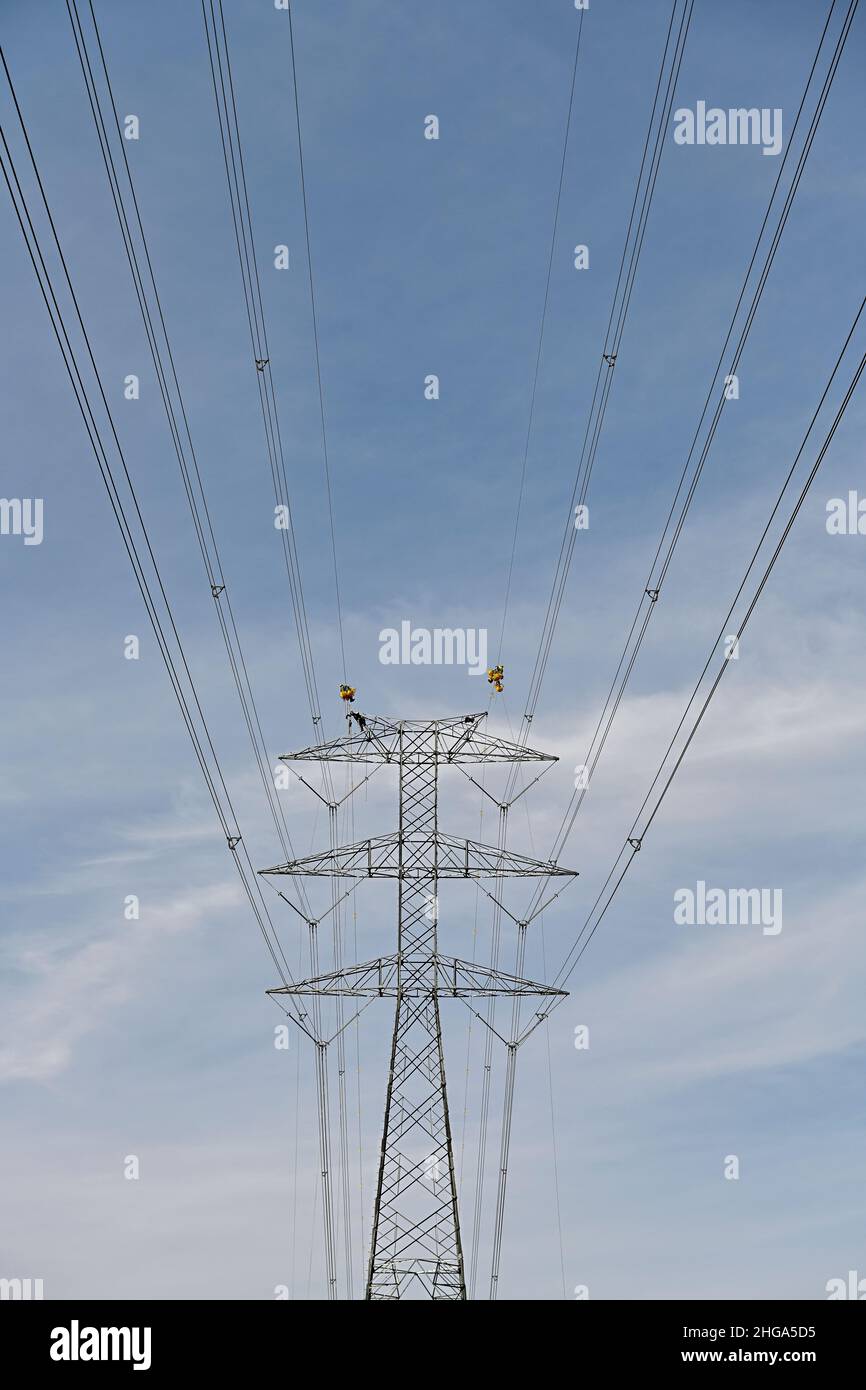 Installation and assembly of high-rise electrical towers Stock Photo ...